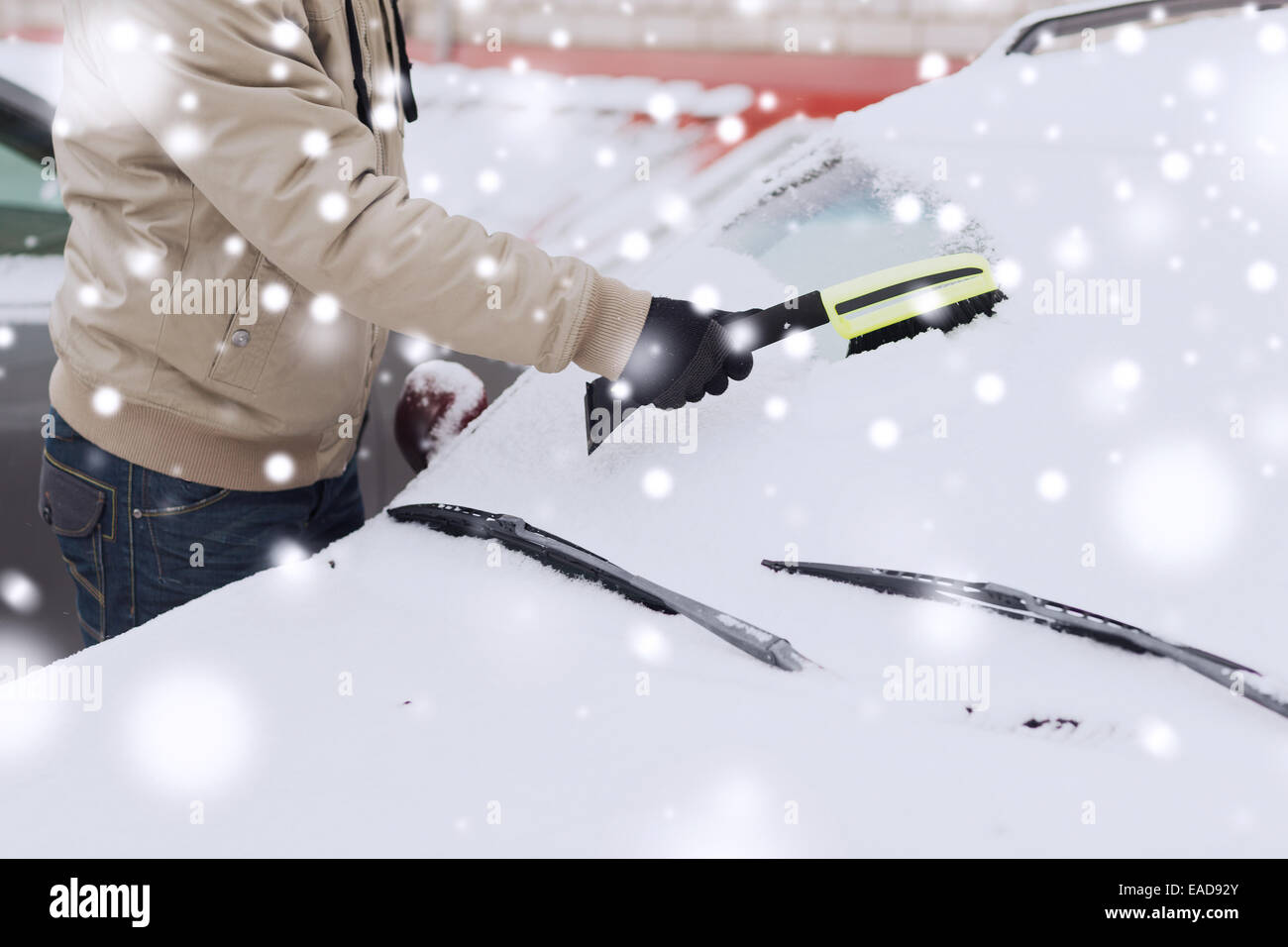 closeup of man cleaning snow from car Stock Photo - Alamy