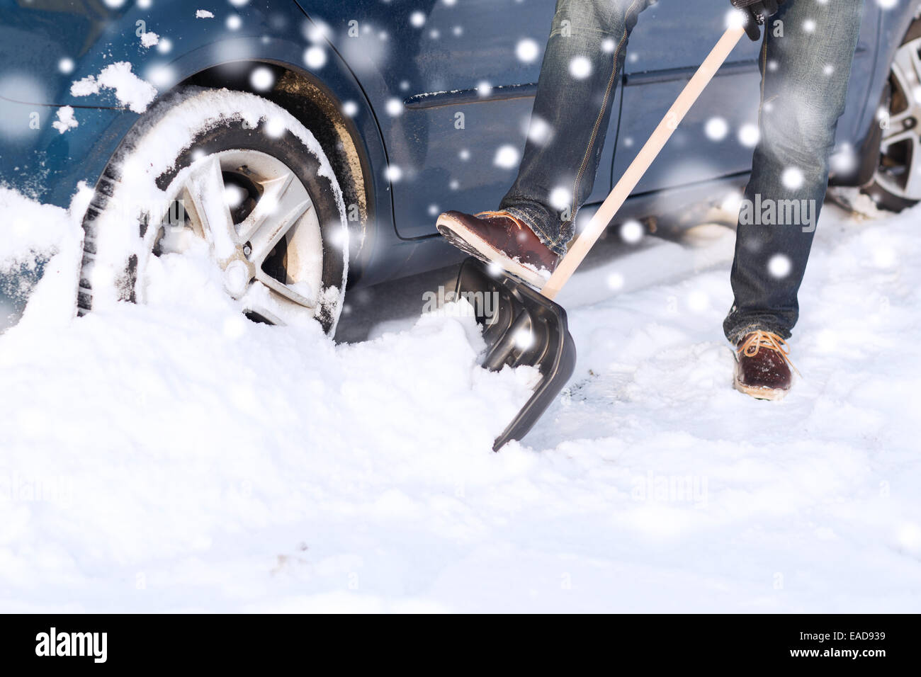 closeup of man digging snow with shovel near car Stock Photo - Alamy