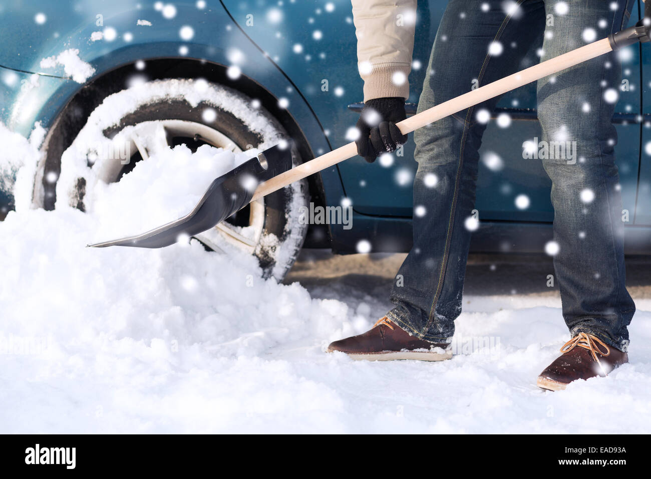 closeup of man digging snow with shovel near car Stock Photo - Alamy