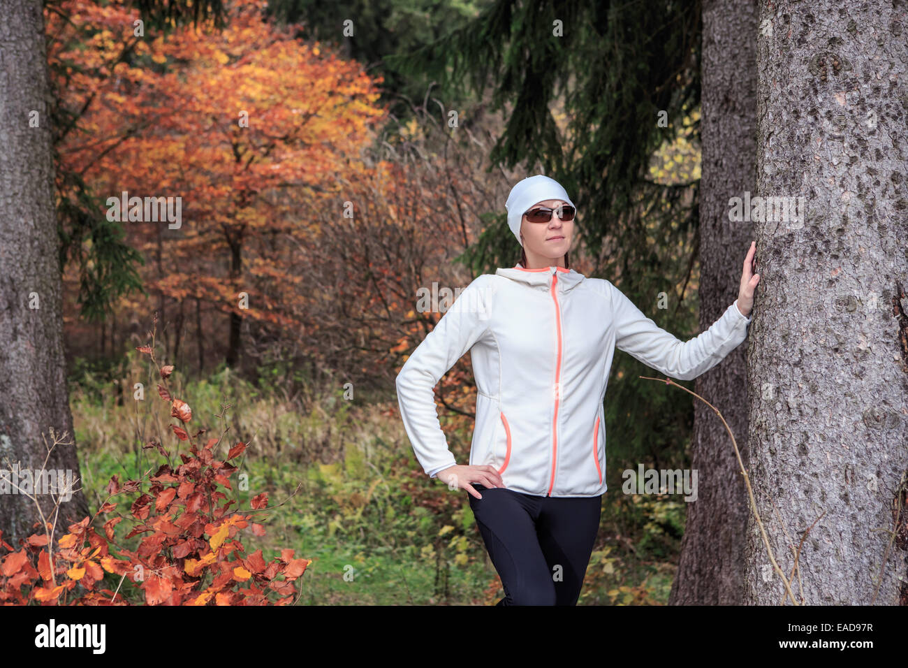 woman running through the forest by the lake Stock Photo - Alamy