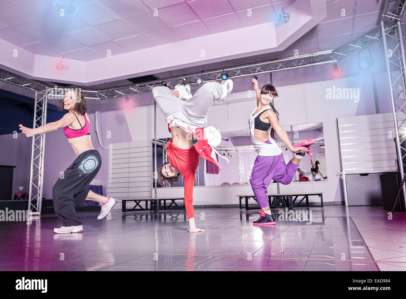 group of women in sport dress at fitness dance exercise or aerobics ...