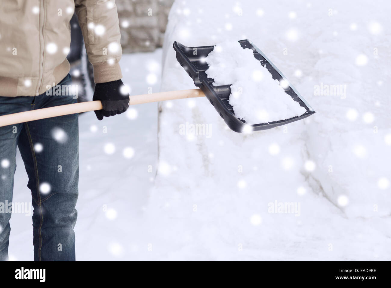 Man shoveling snow near hi-res stock photography and images - Alamy