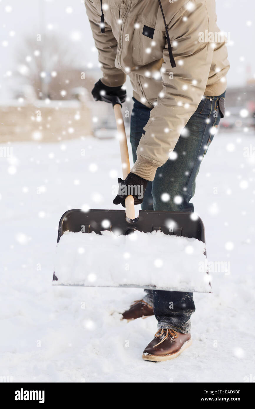 closeup of man digging snow with shovel Stock Photo - Alamy