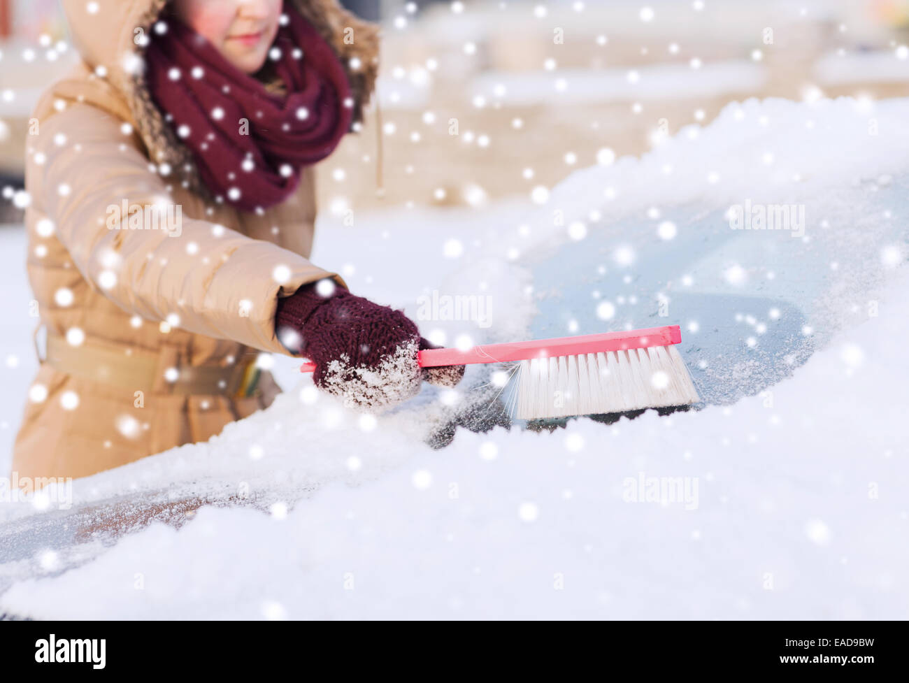 closeup of woman cleaning snow from car Stock Photo - Alamy