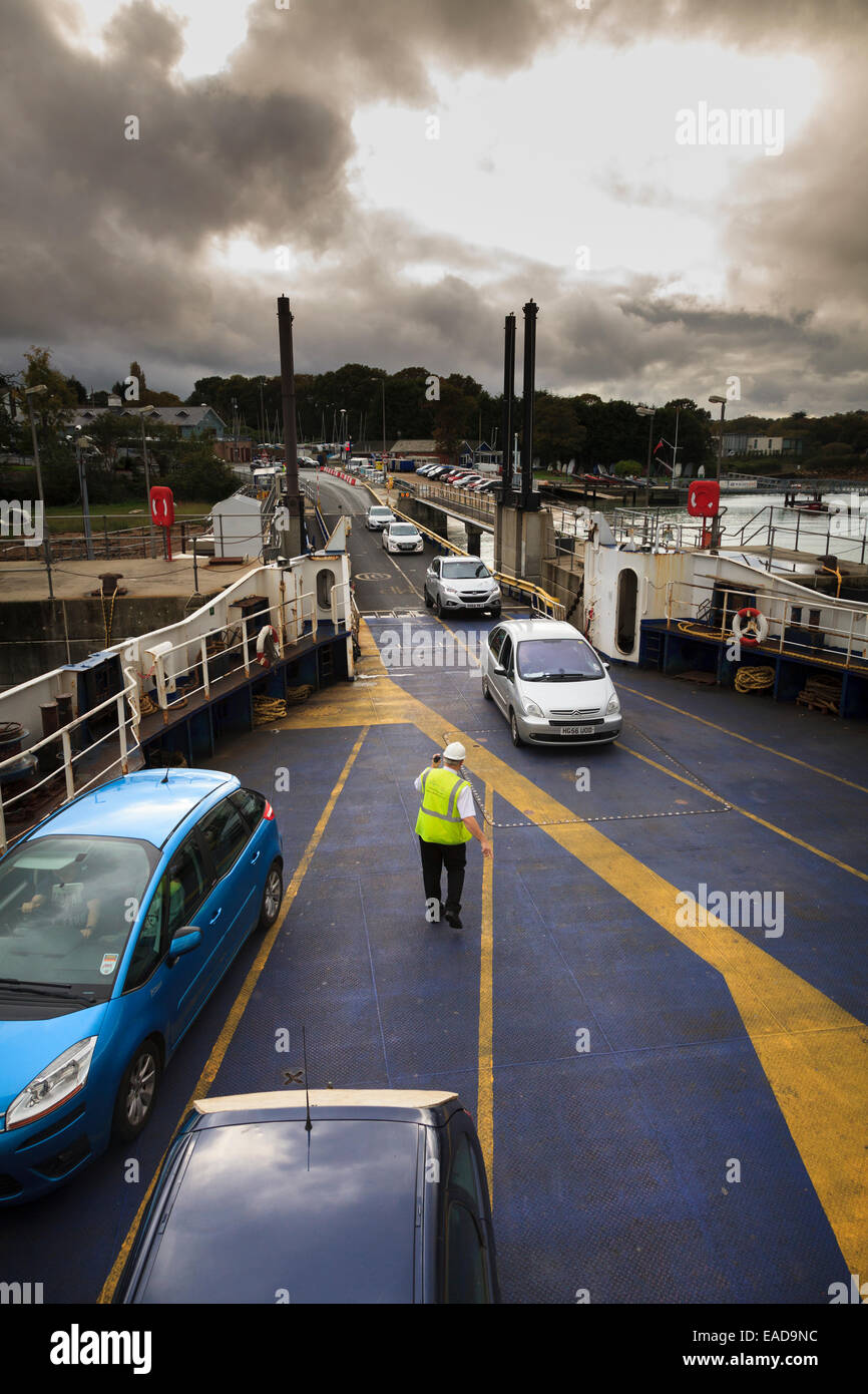 Vehicles loading down boarding ramp onto car ferry Stock Photo - Alamy