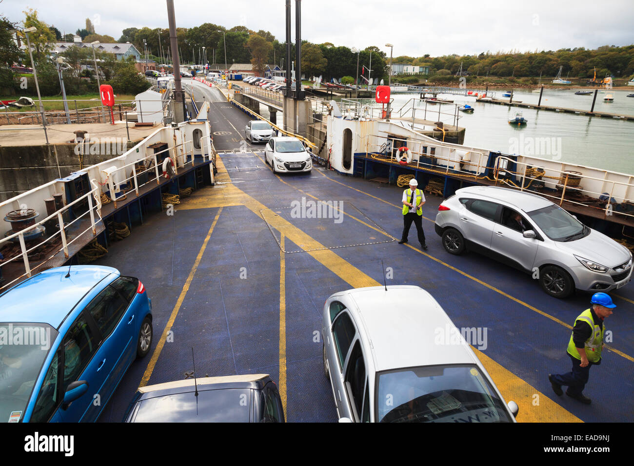 Vehicles loading down boarding ramp onto car ferry Stock Photo - Alamy