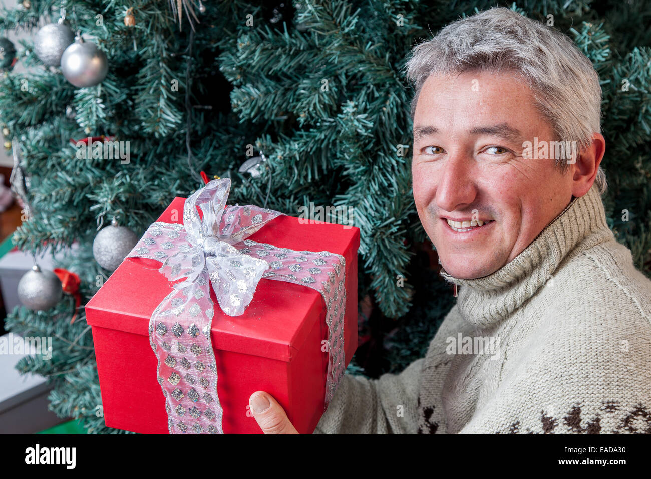 Man sitting beside tree hi-res stock photography and images - Alamy