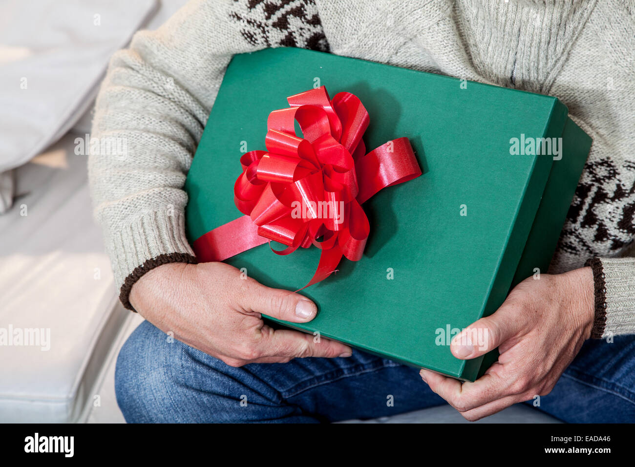Man with a gift Stock Photo - Alamy
