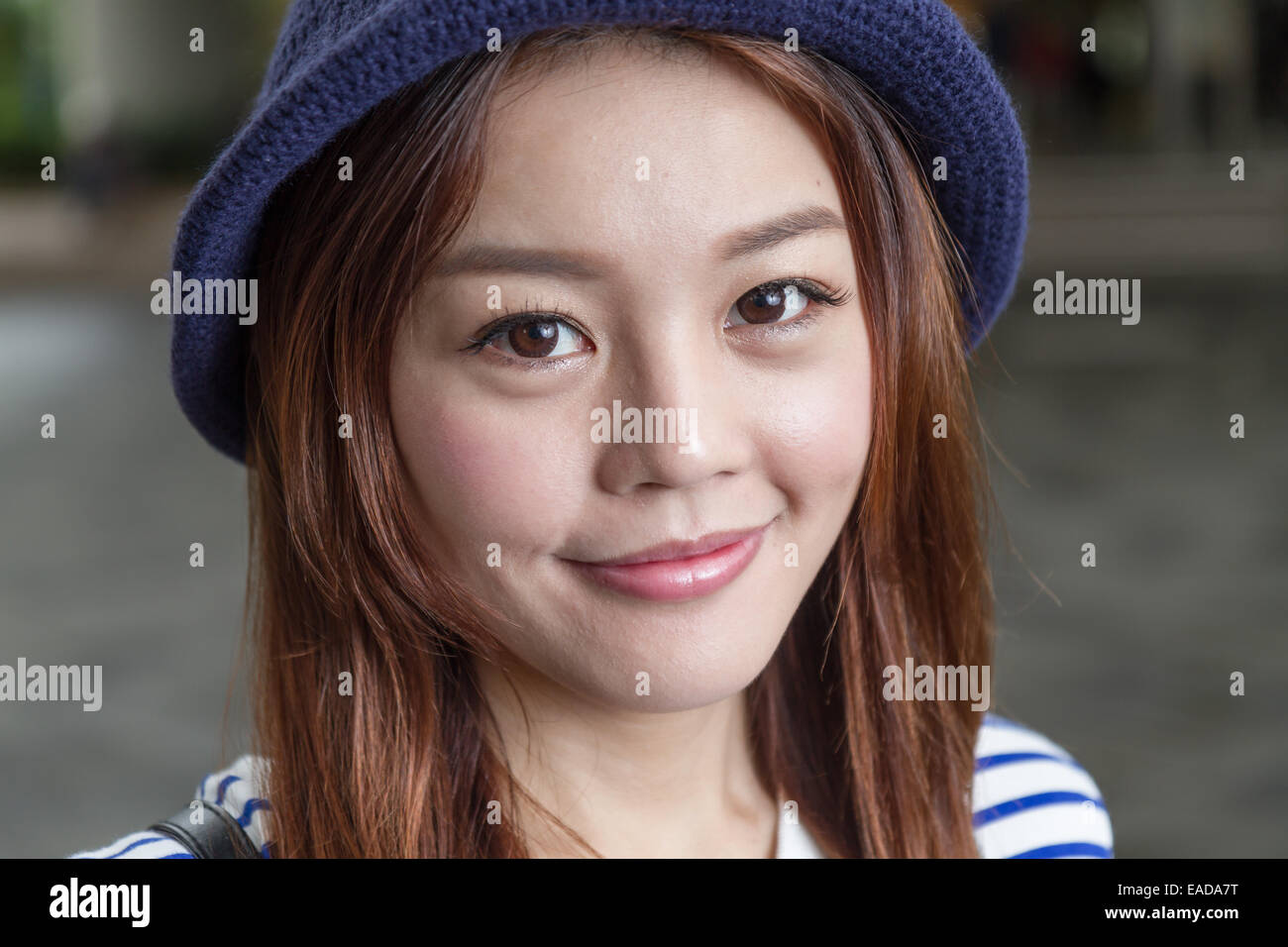 Portrait of cute Chinese girl in a knitted cap Stock Photo - Alamy