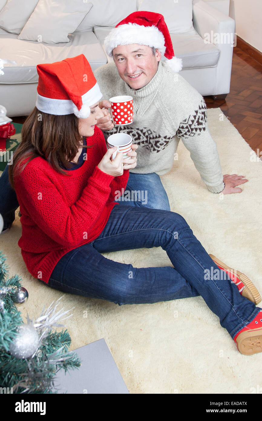 Couple drinking a cupful of coffee Stock Photo - Alamy