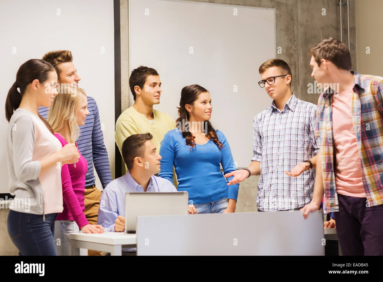 group of students and teacher with laptop Stock Photo - Alamy