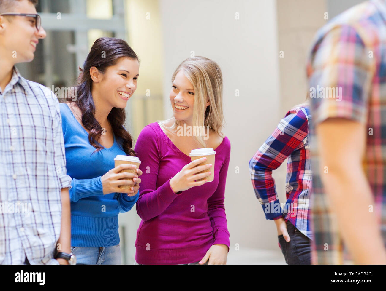 group of smiling students with paper coffee cups Stock Photo - Alamy