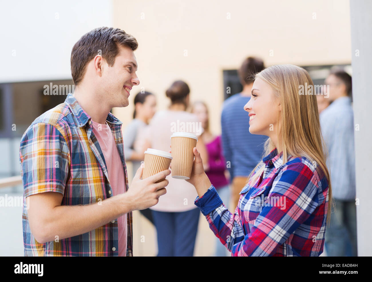 group of smiling students with paper coffee cups Stock Photo - Alamy