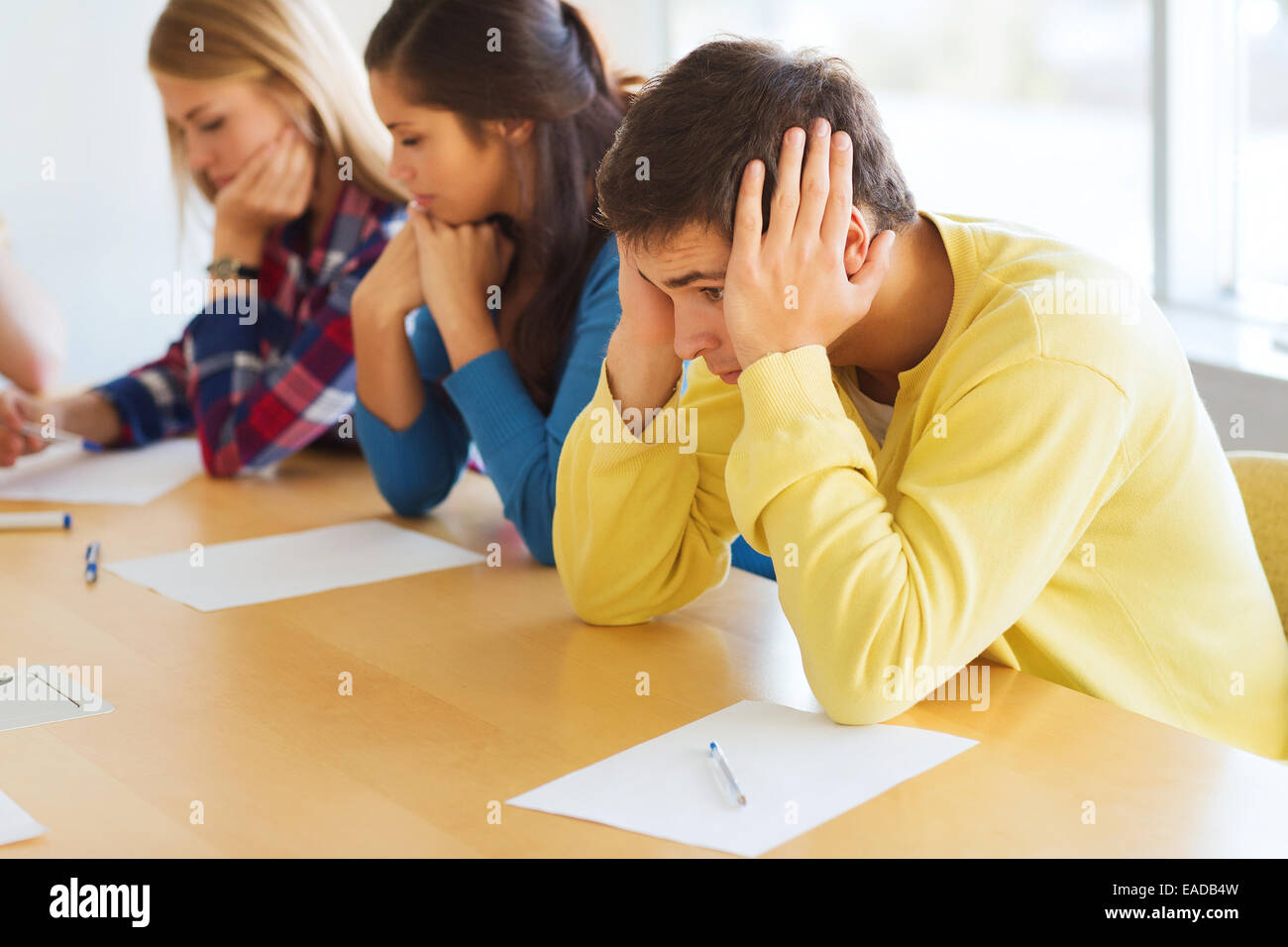 group of students with papers Stock Photo - Alamy