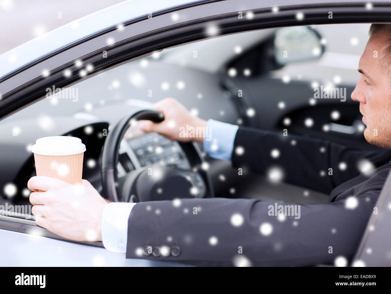 close up of man drinking coffee while driving car Stock Photo - Alamy