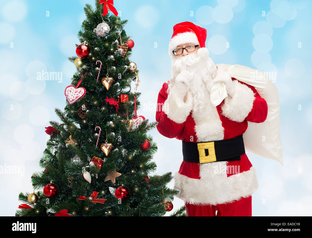 santa claus with bag and christmas tree Stock Photo - Alamy