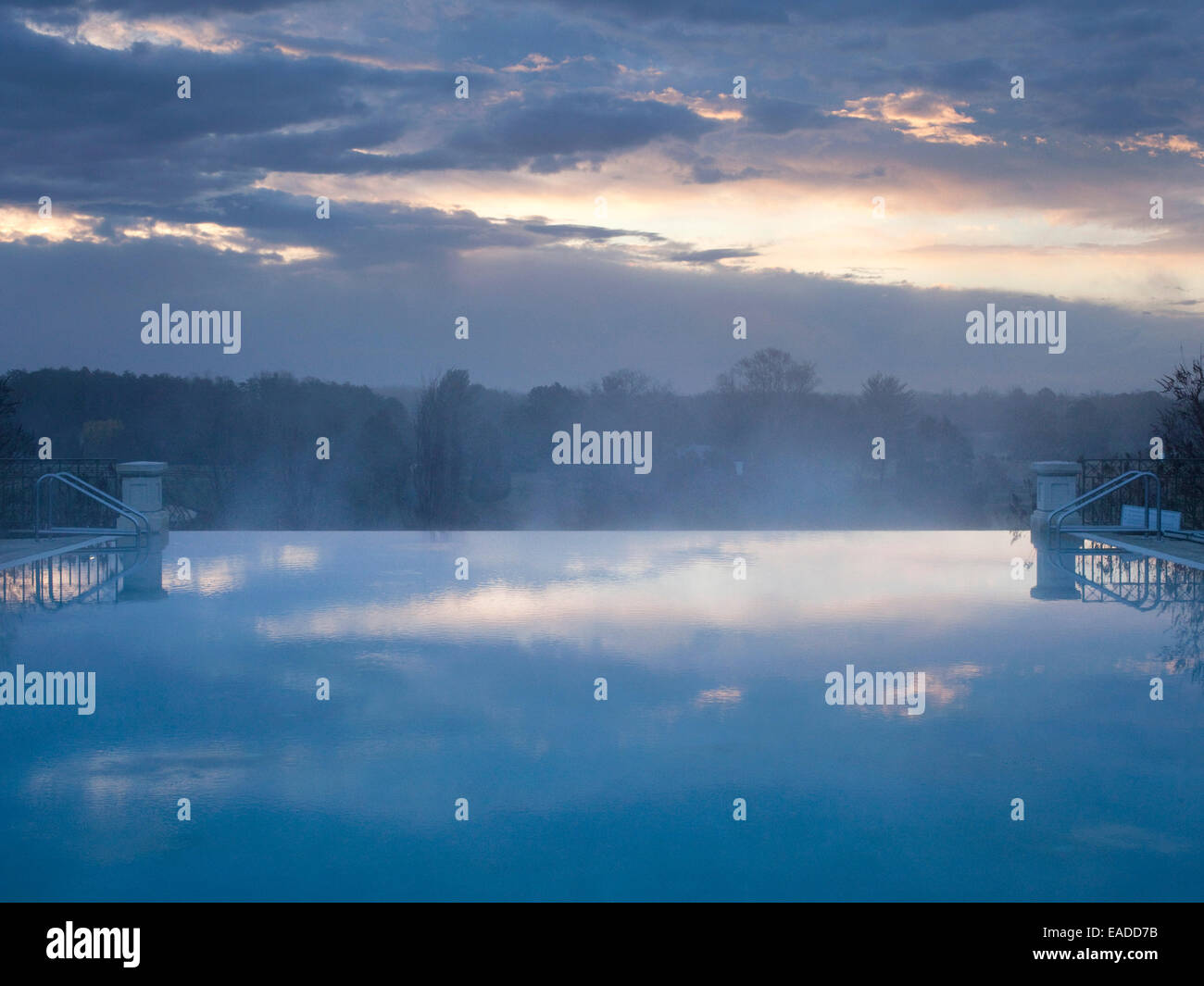 country side with Infinity pool at dawn with fog Stock Photo - Alamy