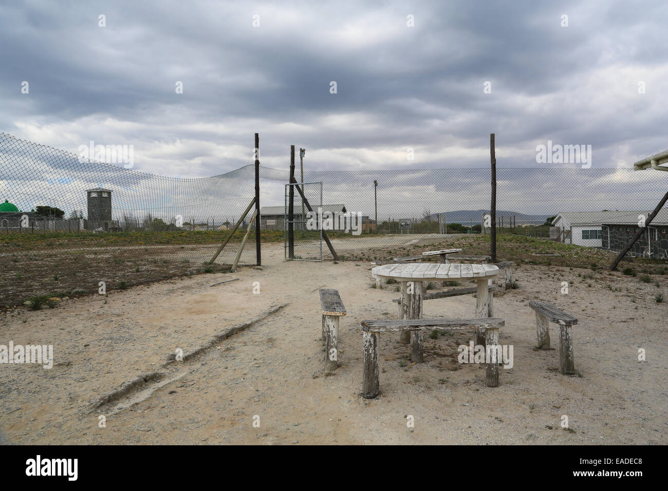Crude table and bench seats on the prison grounds at Robben Island near ...