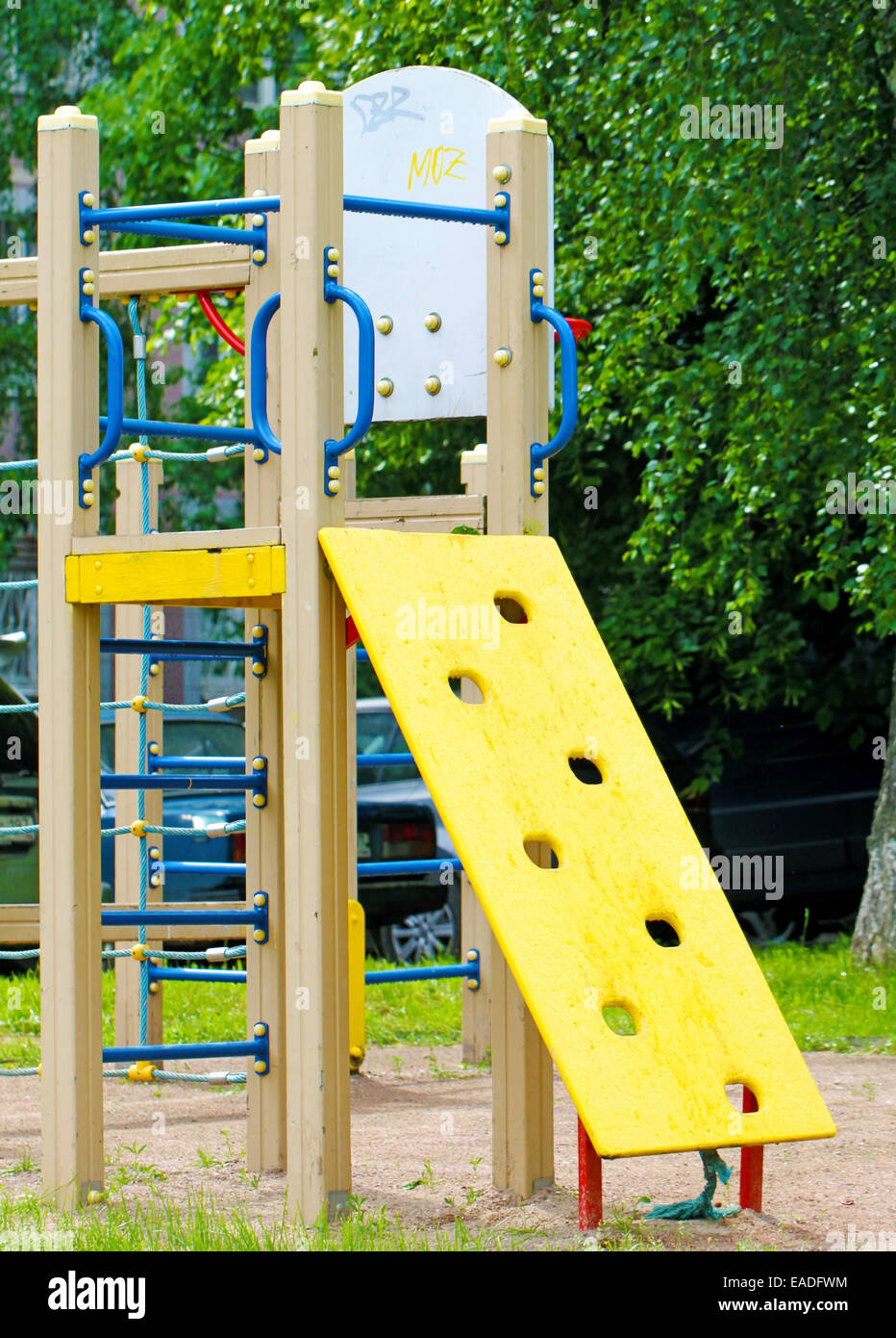 playground in a city on a background of green trees Stock Photo - Alamy