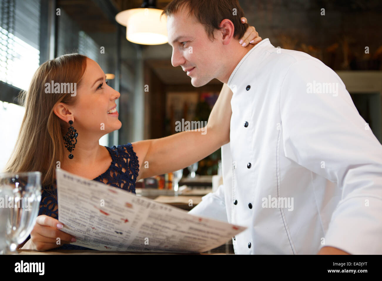 Chef discussing the menu with guest Stock Photo - Alamy