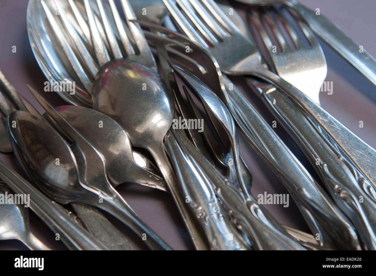 A small pile of silverware Stock Photo - Alamy