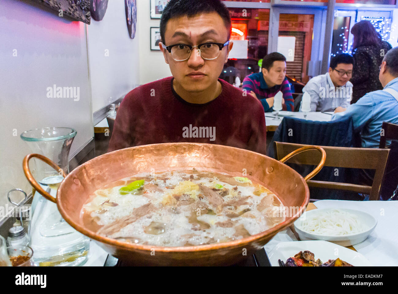 Paris, France, Chinese Man Eating in Chinese Restaurant, Fondue ...