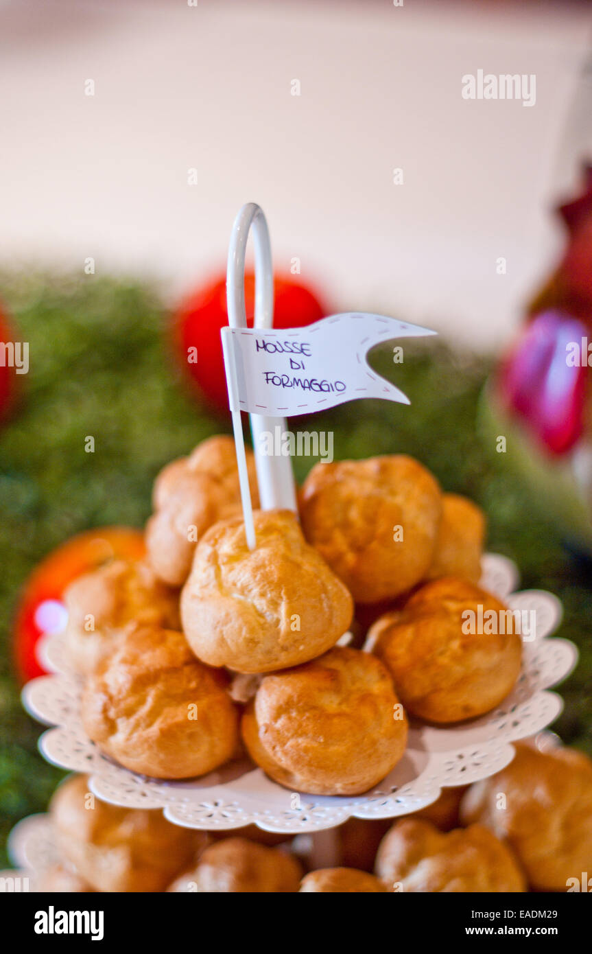 Elegant pyramid of cream puffs to cheese mousse Stock Photo - Alamy