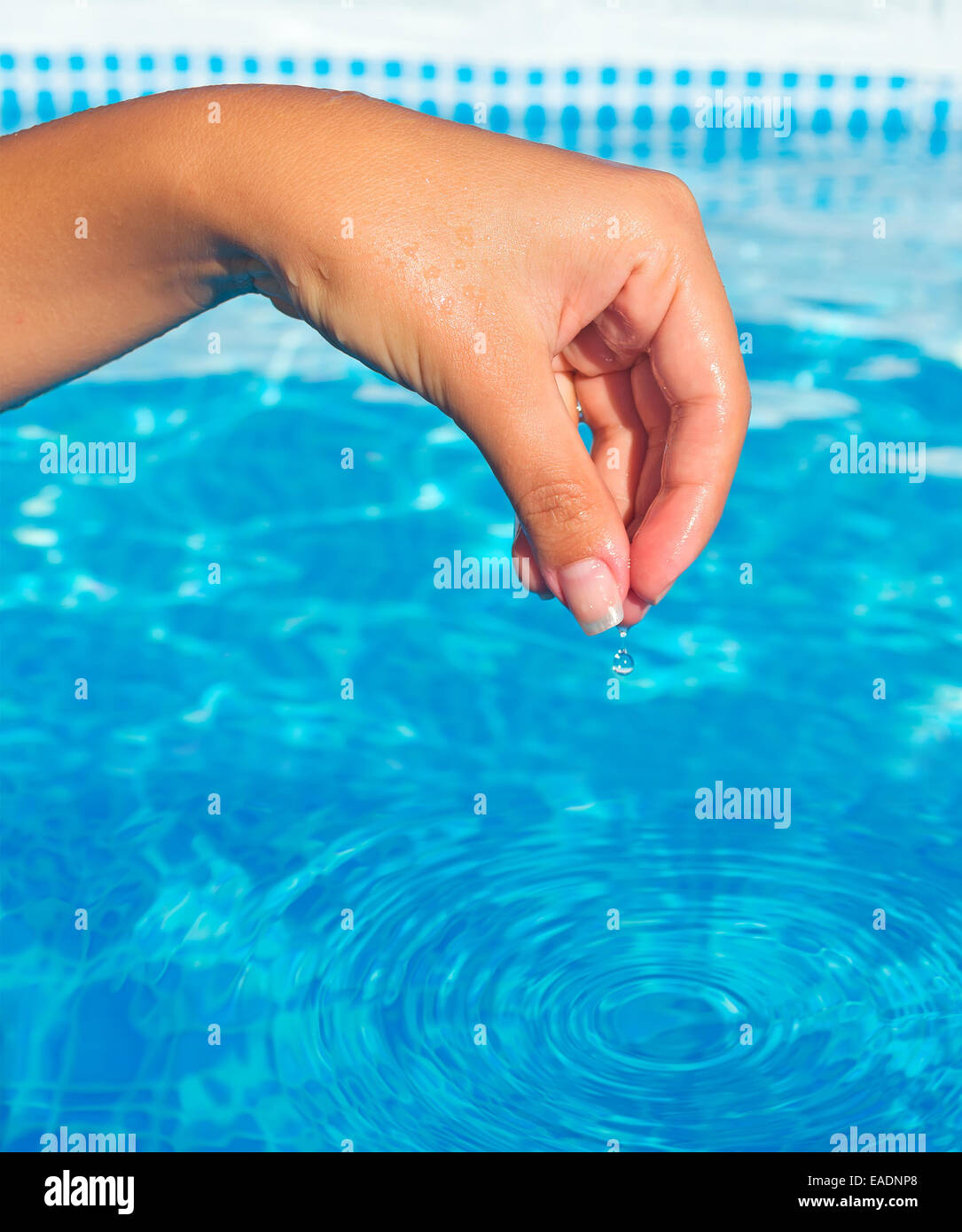 Hand checking water temperature hi-res stock photography and images - Alamy