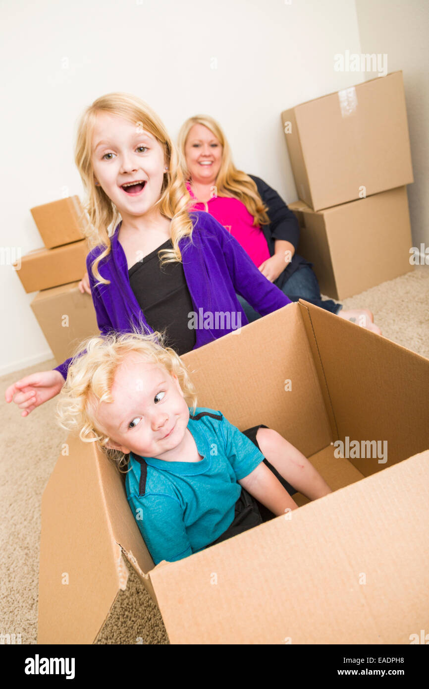Children playing with boxes hi-res stock photography and images - Alamy