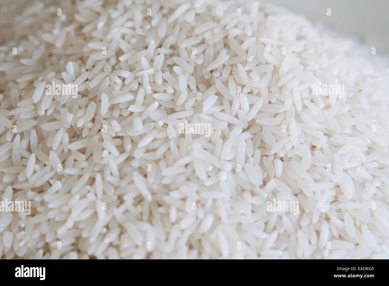 A pile of long grain white rice Stock Photo - Alamy