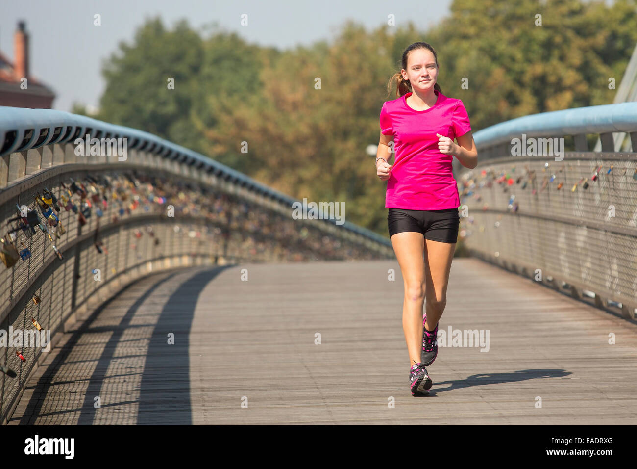 Young cute girl while jogging in the city. Healthy lifestyle Stock ...