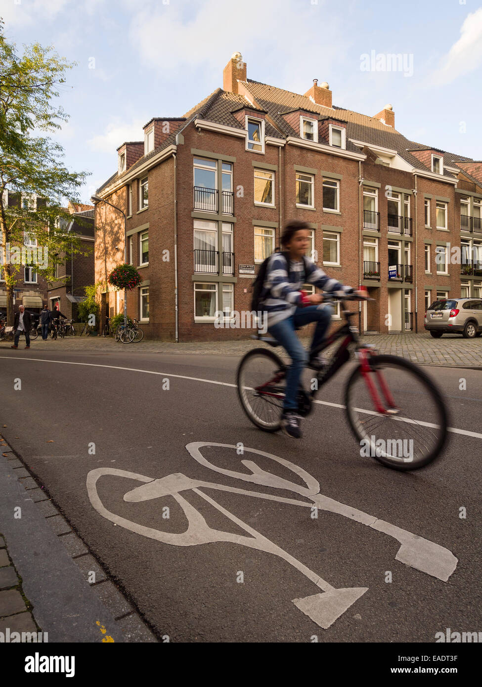 Man riding his bicycle on a bike lane in Maastricht, The Netherlands ...