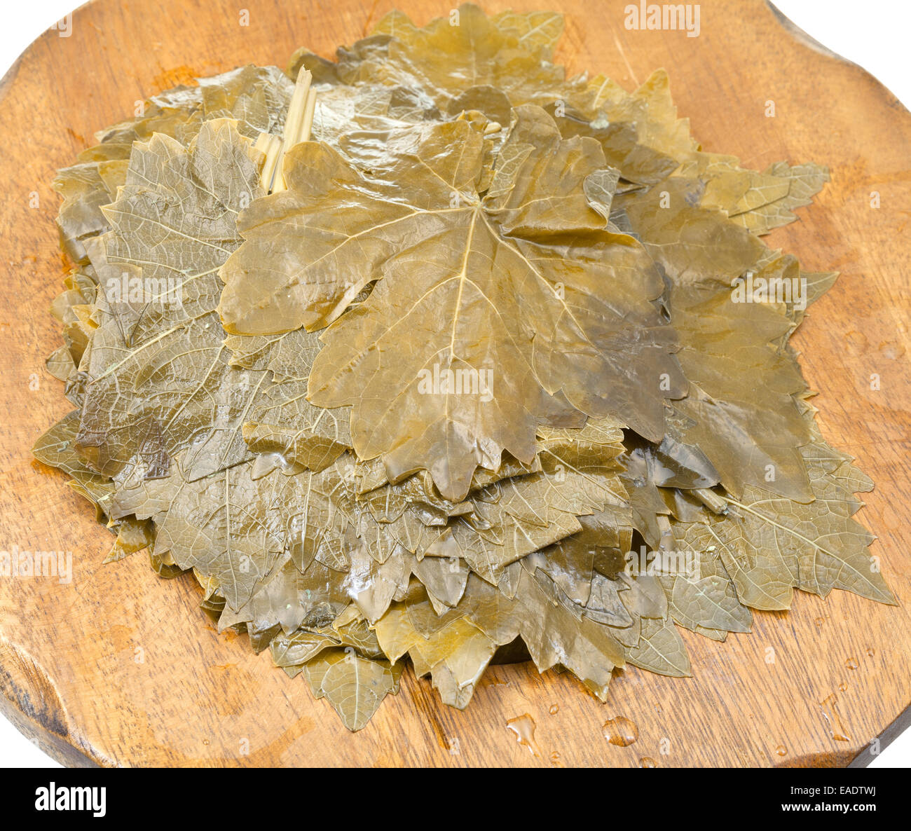 pickled grape leaves on wooden cutting board close up Stock Photo - Alamy