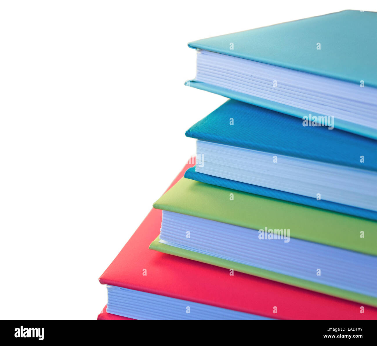 stack of colorful books on white background Stock Photo - Alamy