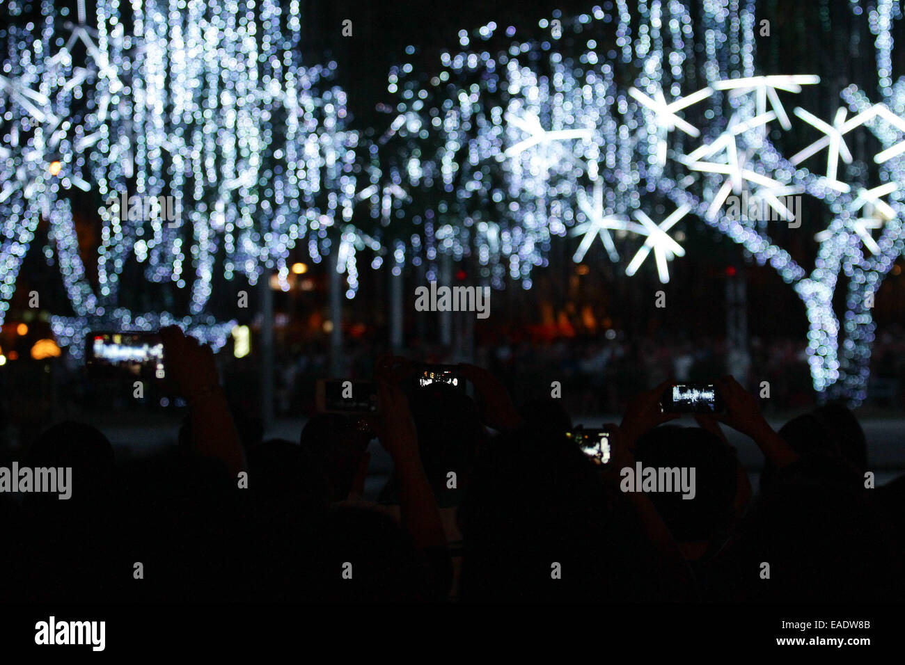 Spectators record the Festival of Lights with their mobile devices in ...