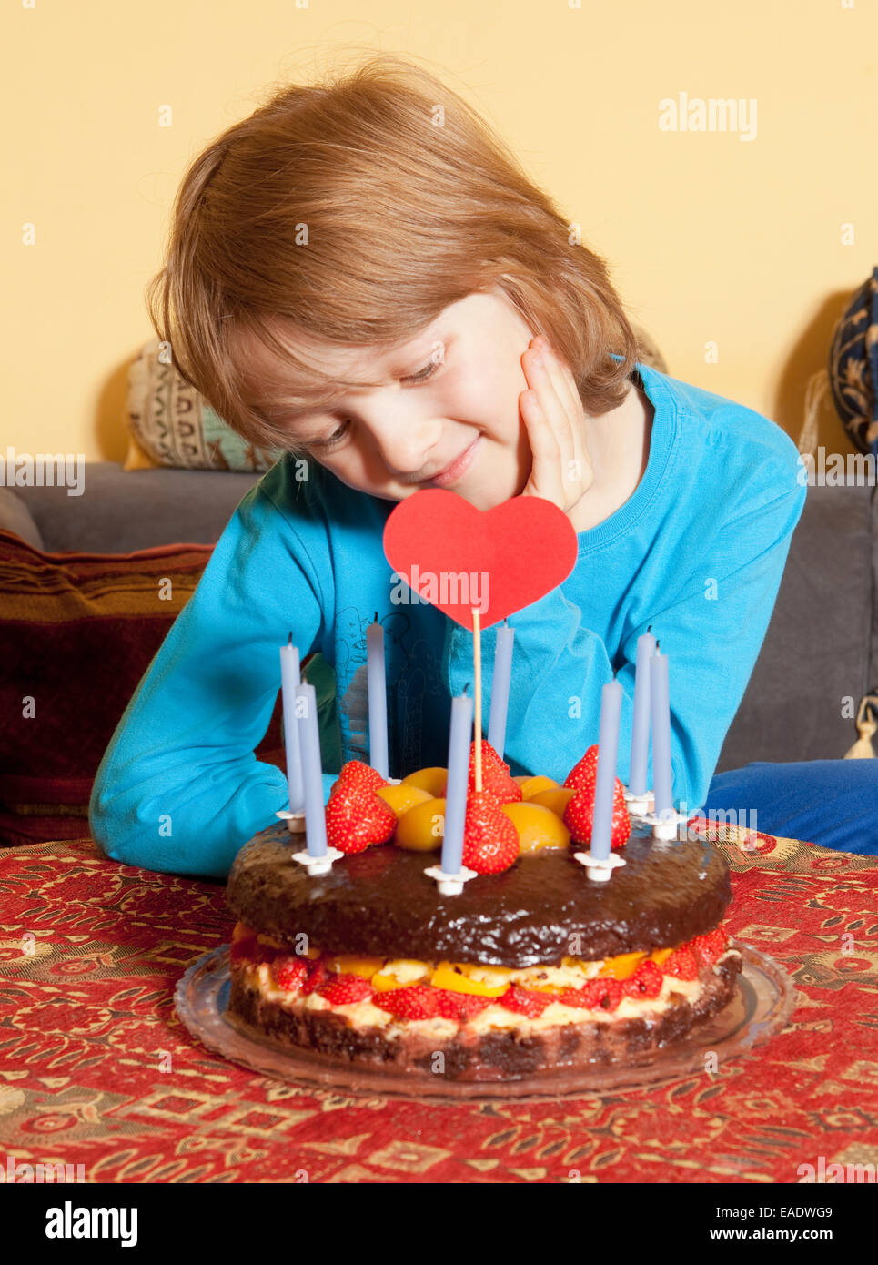 Child looking at birthday cake hi-res stock photography and images - Alamy