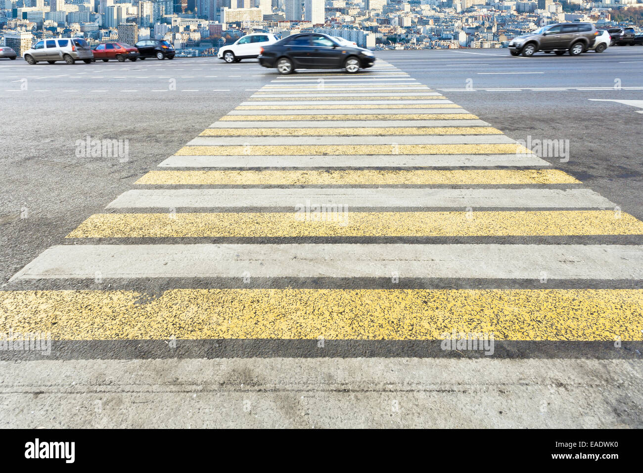 yellow and white crossing zebra of pedestrian crosswalk on street Stock ...