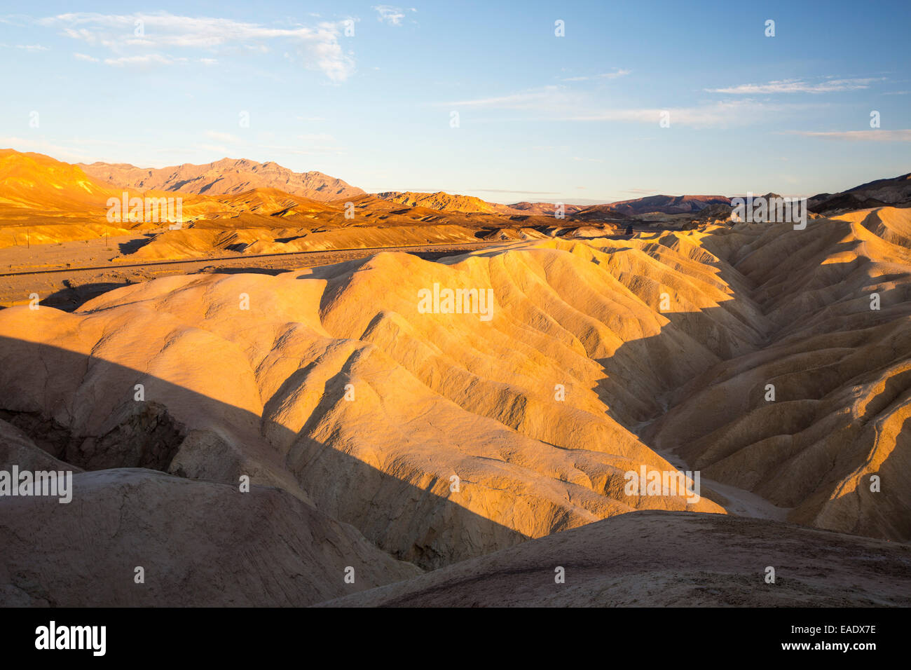 Badland scenery at sunset, Zabriskie Point in Death Valley which is the ...