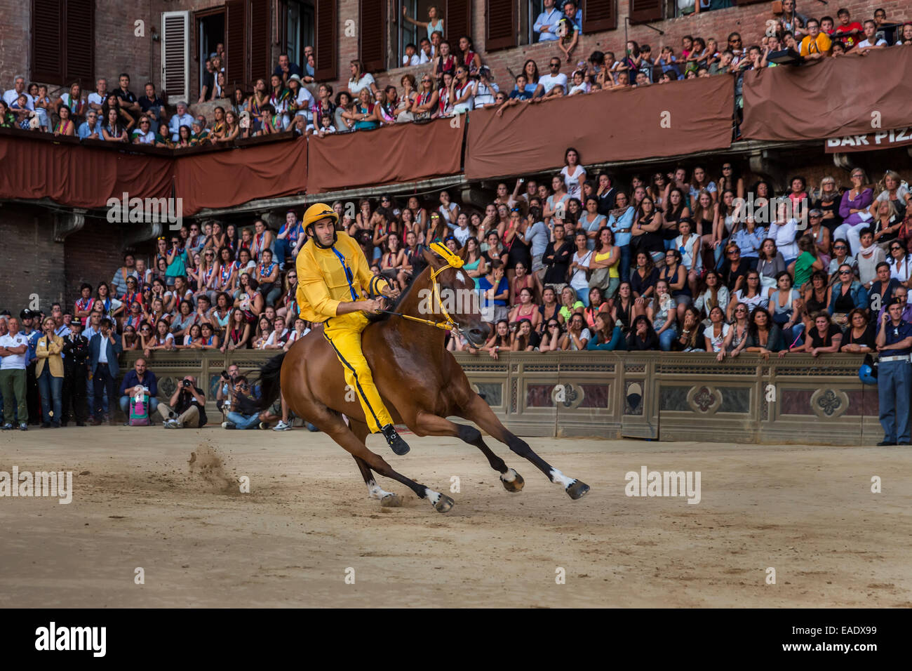 The Palio di Siena horse race on Piazza del Campo, Siena, Tuscany ...