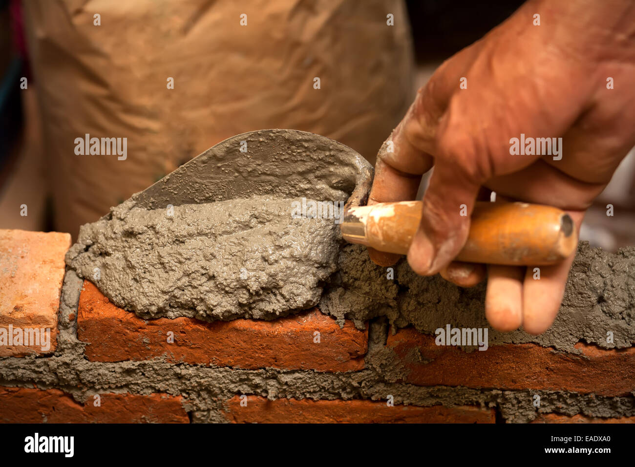 Building brick wall with cement Stock Photo - Alamy
