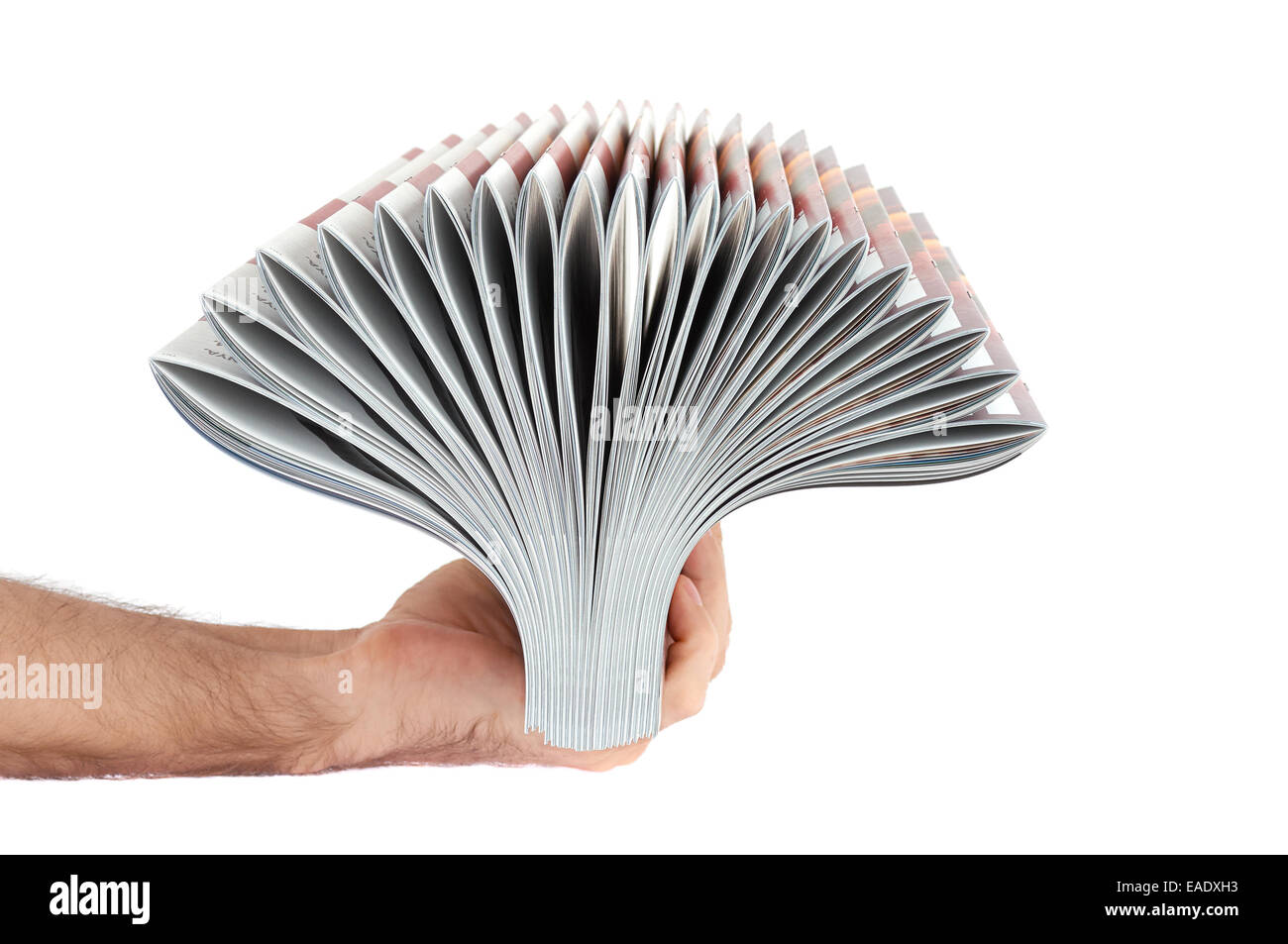 Pile of magazines in hand isolated over white background Stock Photo ...