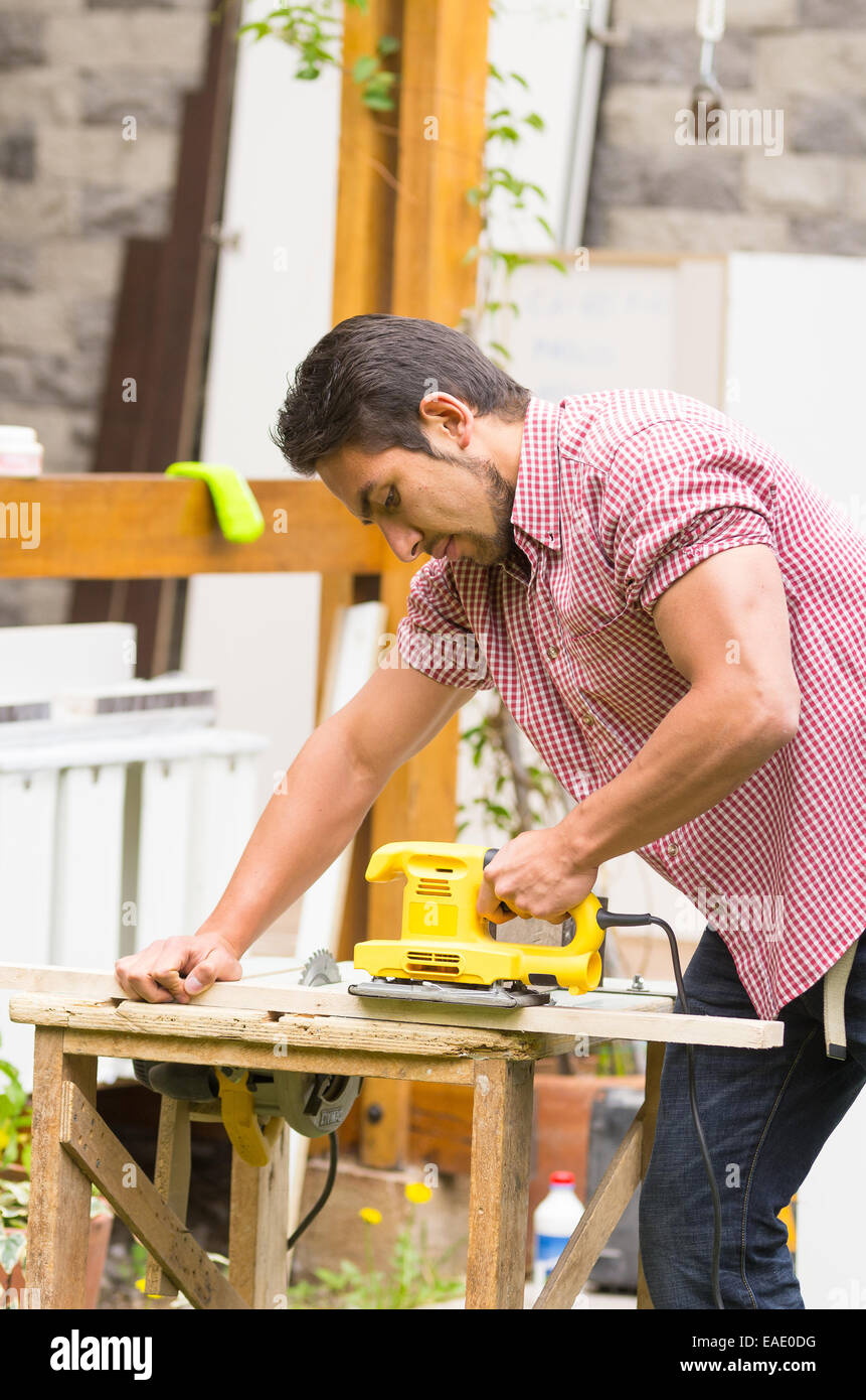 man working with an electrical sander Stock Photo - Alamy