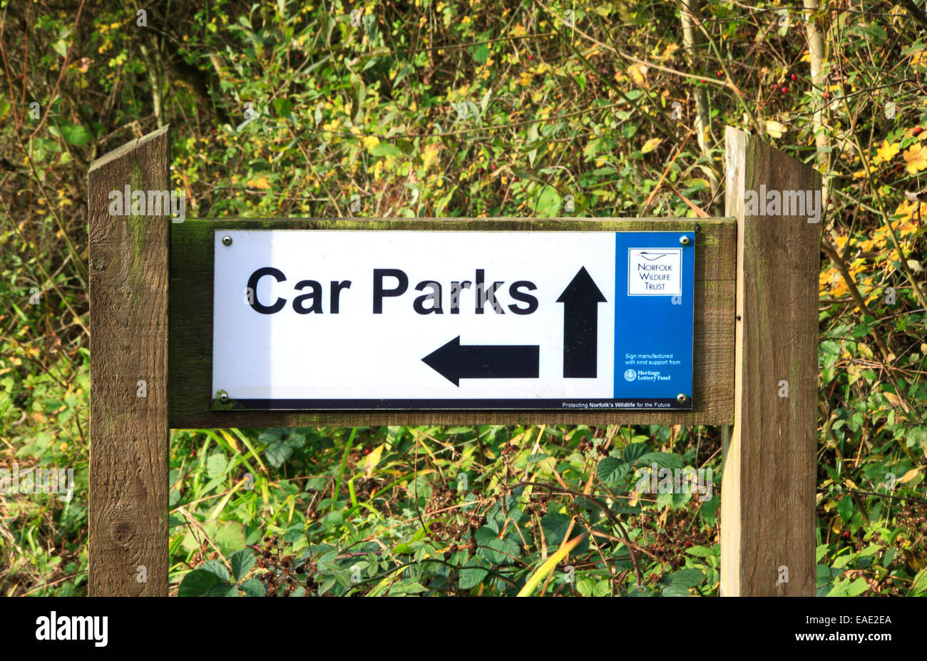 A car park sign with arrows at Foxley Wood Nature Reserve, Norfolk ...