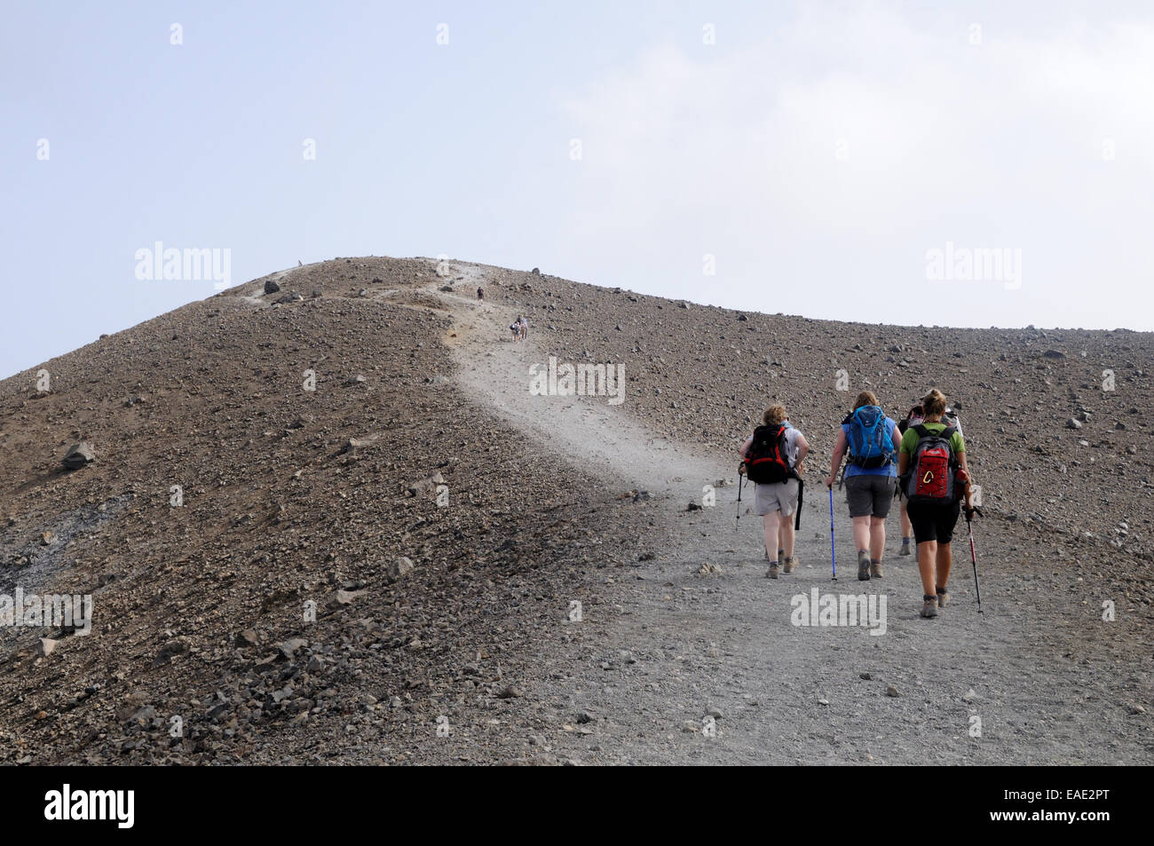 Hikers on the ridge of the volcanic crater Vulcano Island Sicily Italy ...