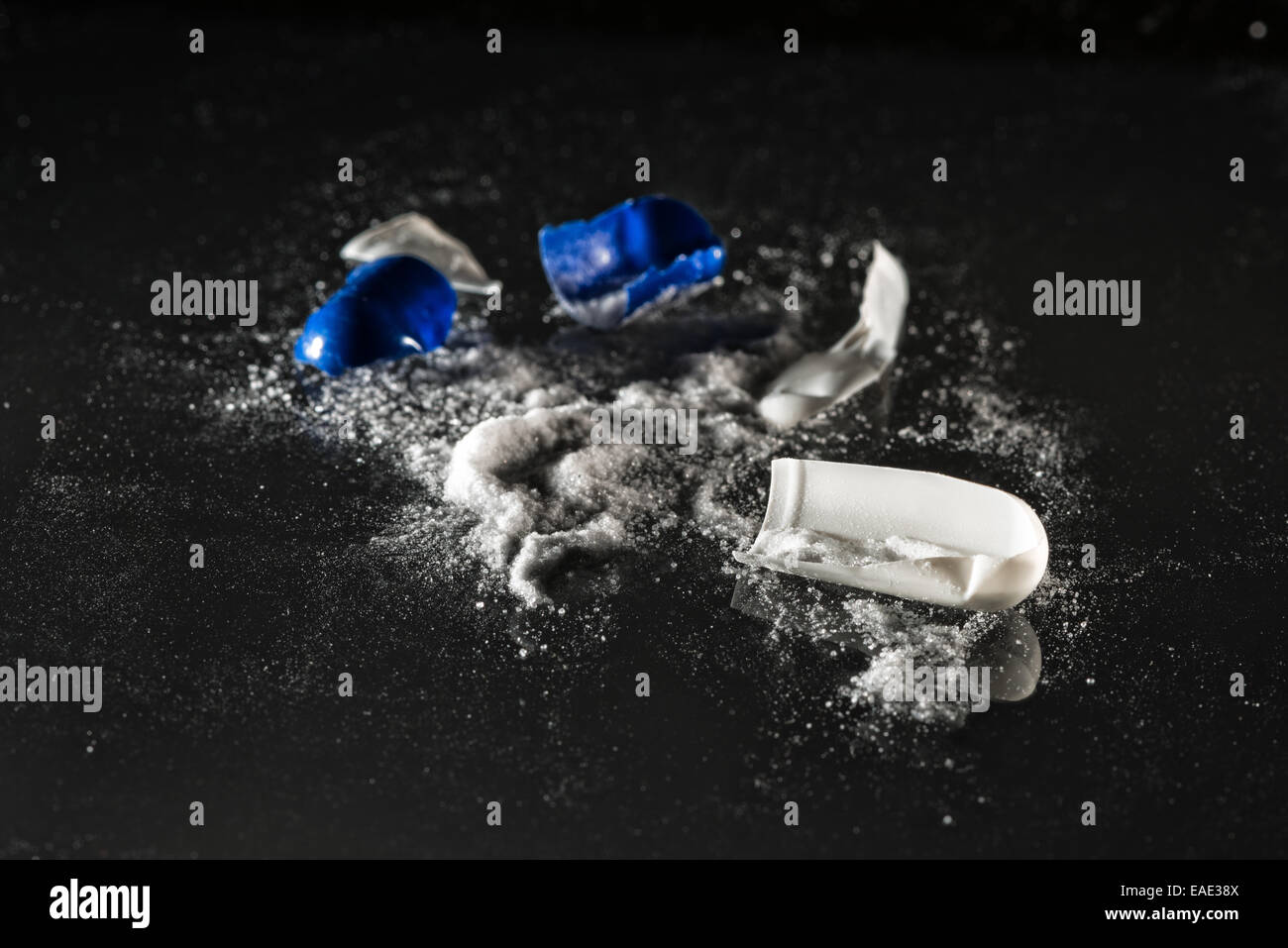 Pain relief contents of broken drug capsule scattered out revealing ...