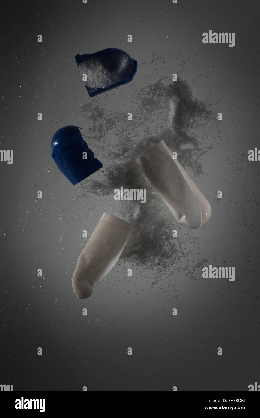 Pain relief contents of broken drug capsule scattered out revealing ...