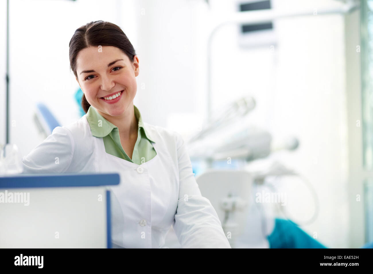 Pretty assistant in uniform looking at camera in hospital Stock Photo ...
