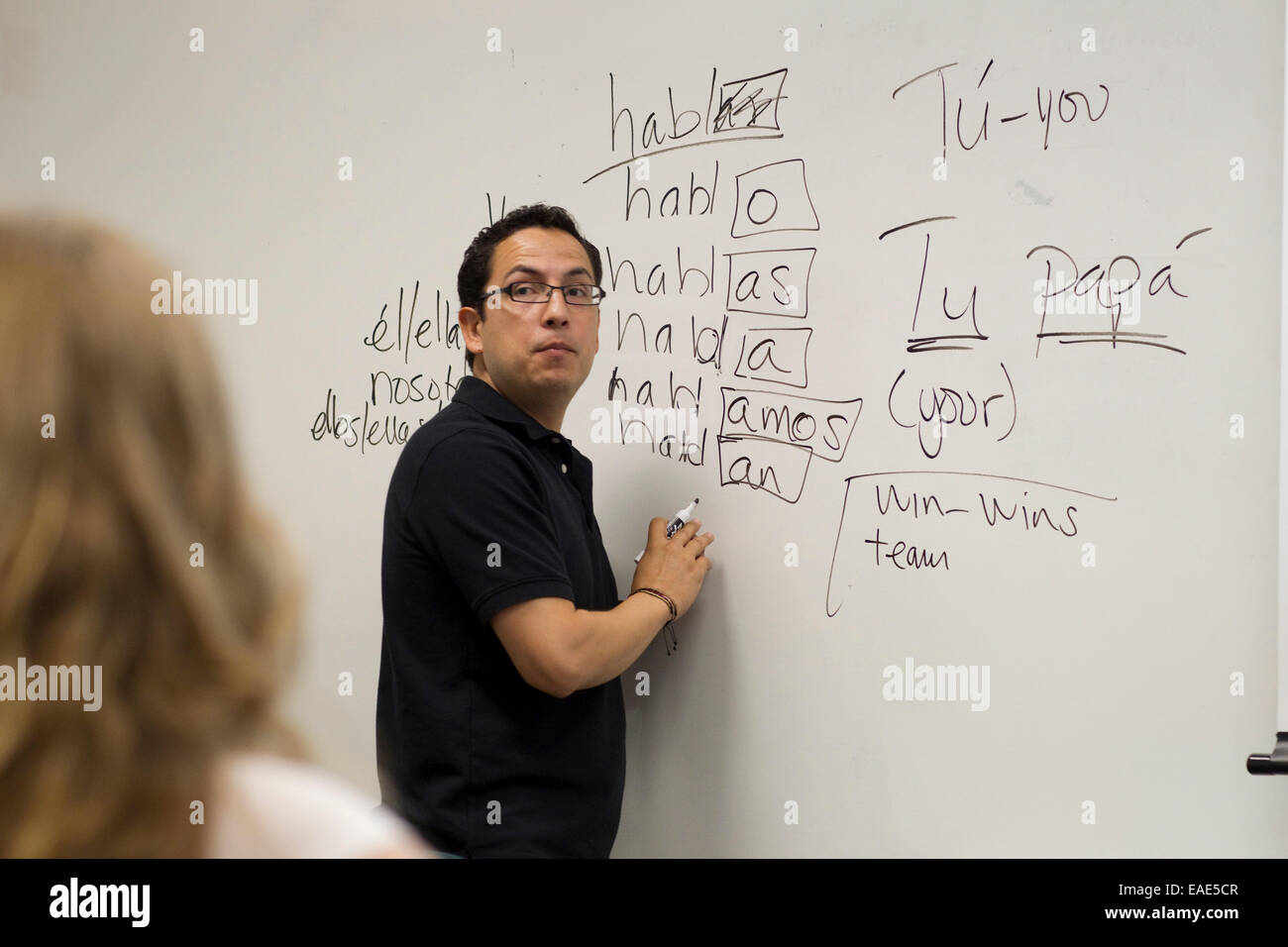 Male Hispanic teacher in class at Achieve Early College High School in ...