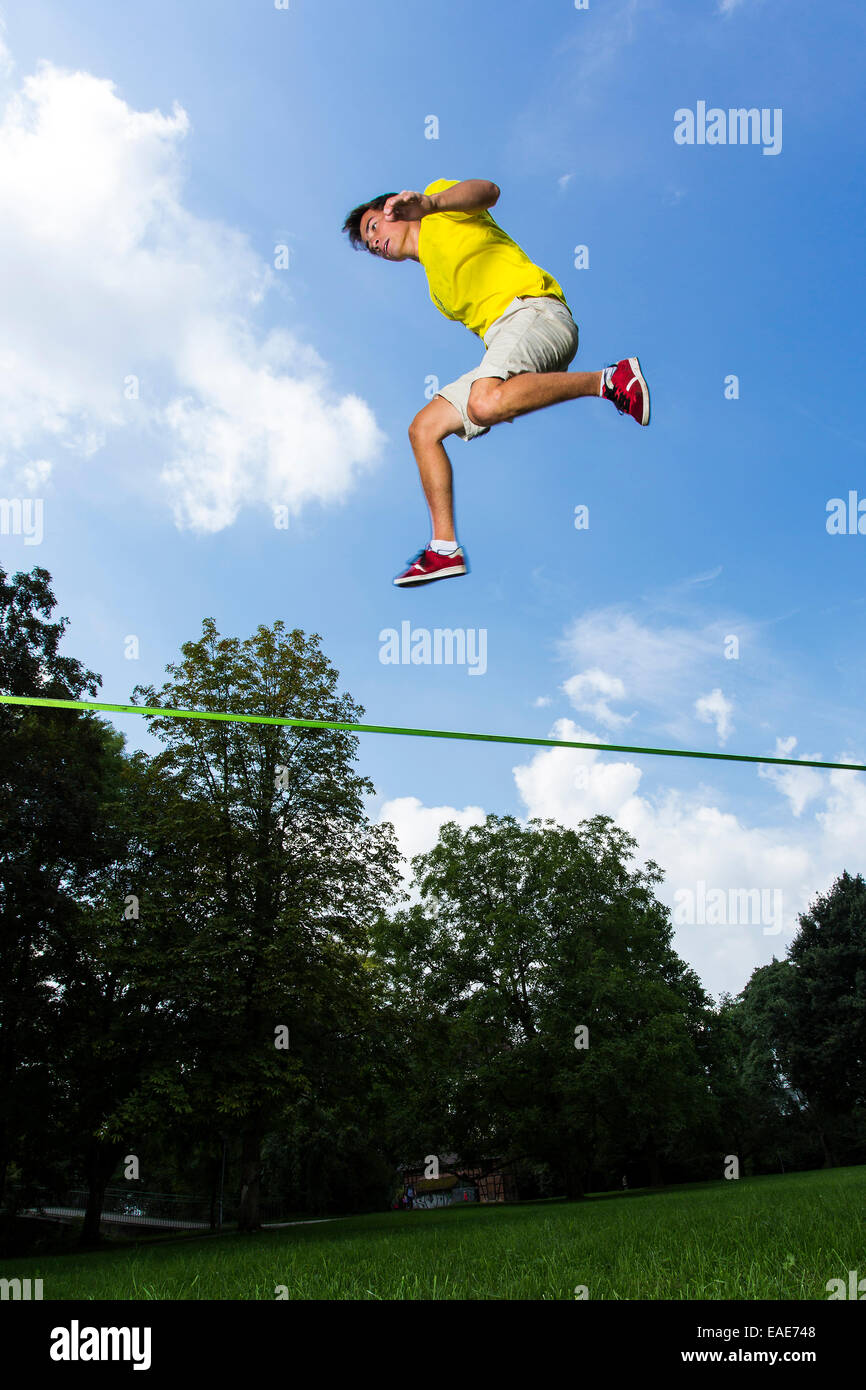 Athlete jumping on slackline hi-res stock photography and images - Alamy