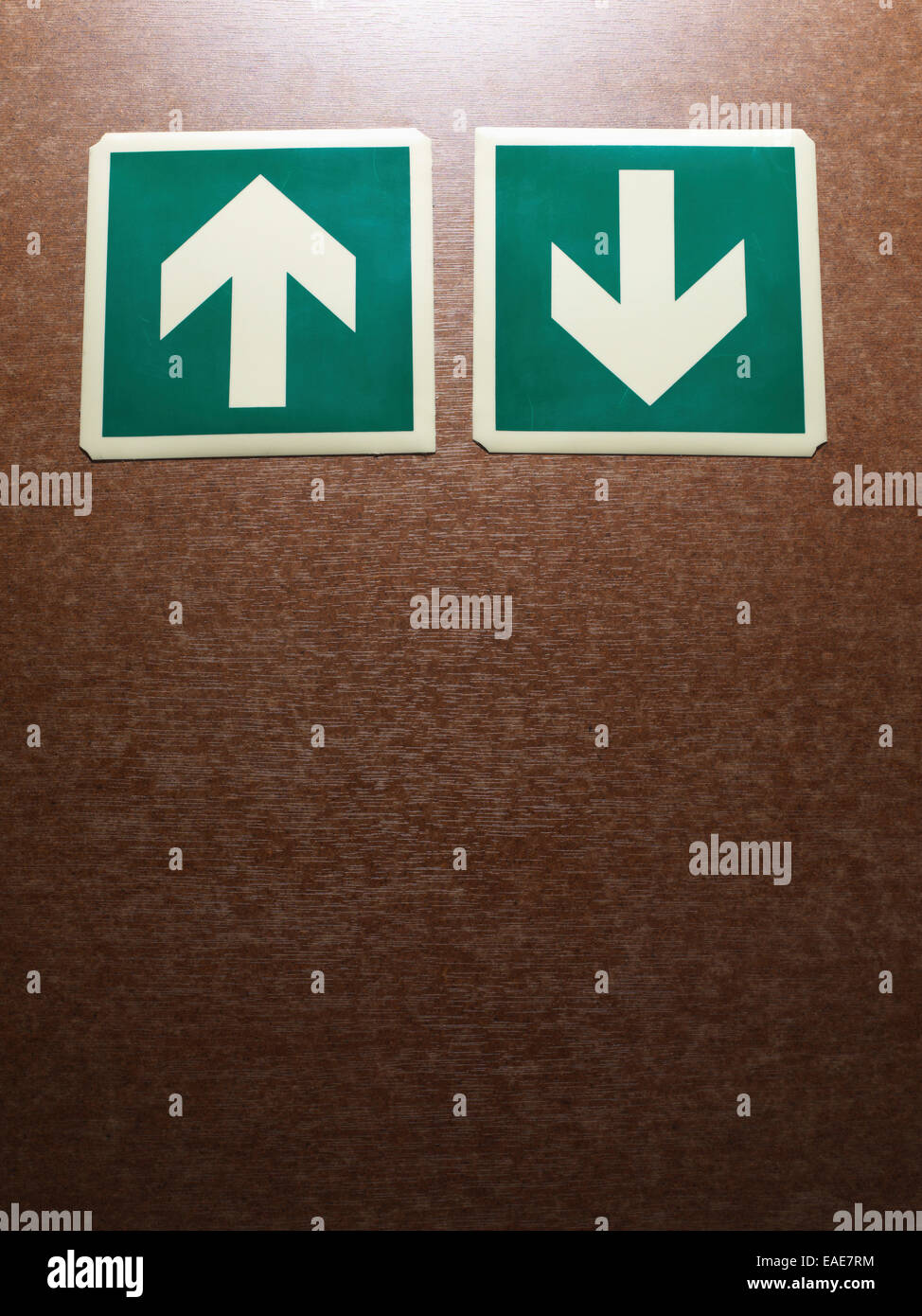 Two arrows pointing up and down Stock Photo - Alamy